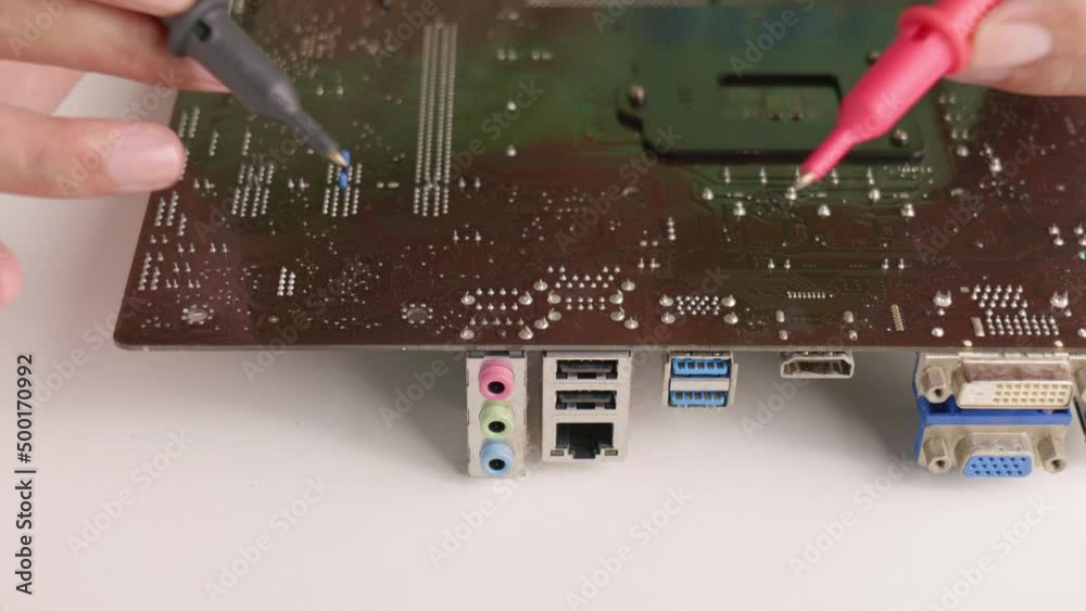Use a power probe to check the computer motherboard for damage. The red ...
