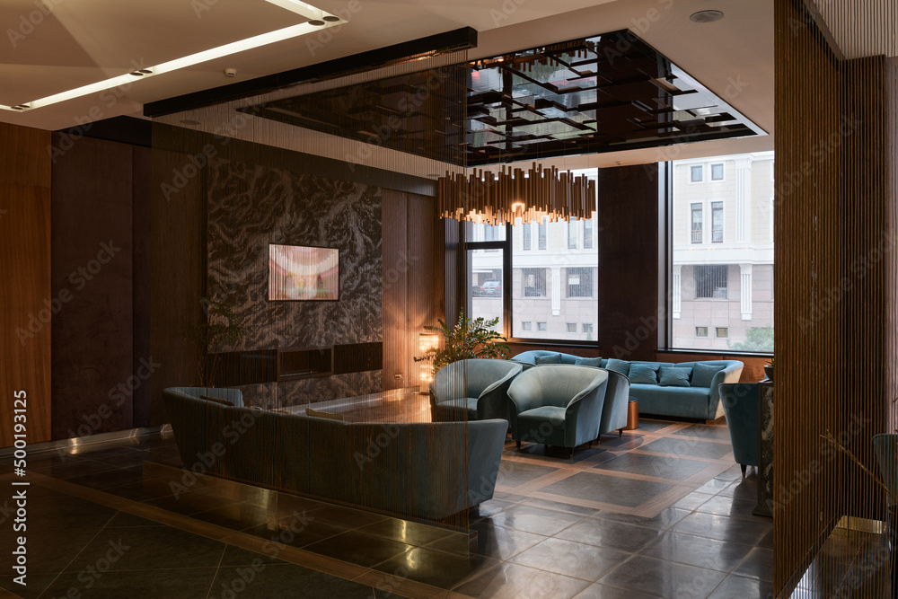 waiting area in a modern house, large space for communication, tv area ...