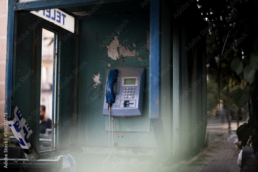 Old blue telephone booth with numbers with cinematic light in Istanbul ...