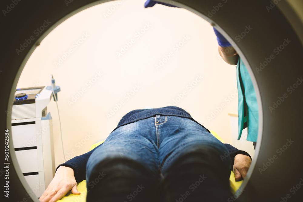 Woman undergoing BTL magnetotherapy in clinic Stock Photo | Adobe Stock