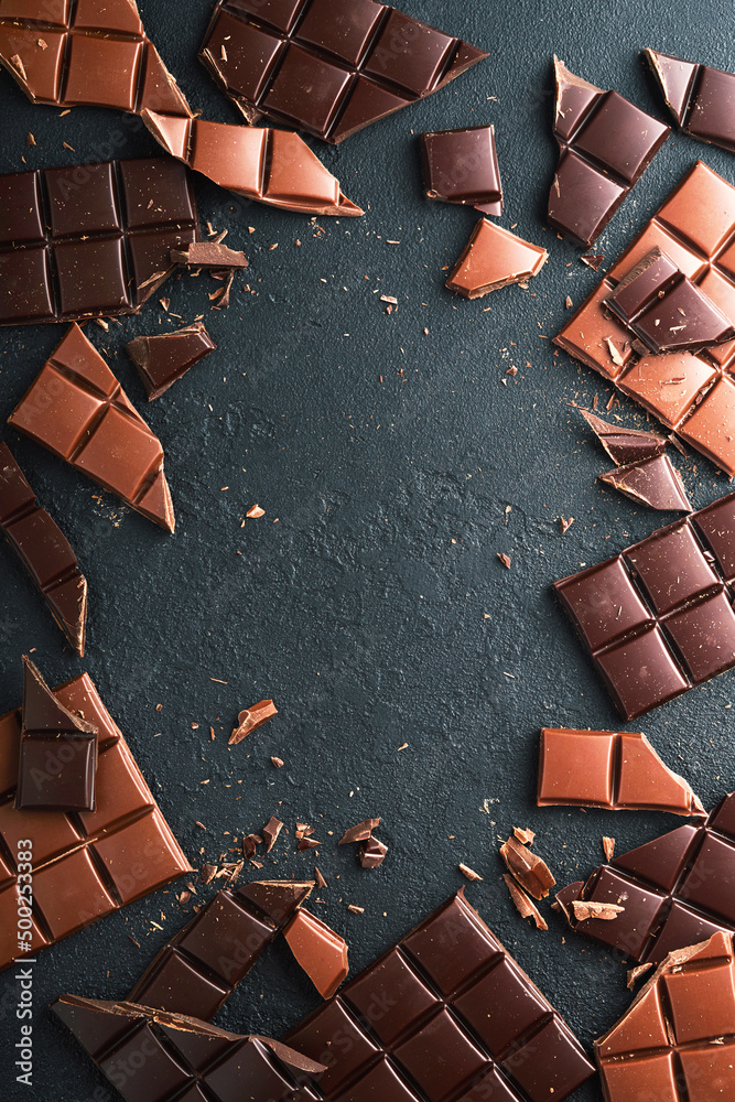 Chocolate pieces. Composition of bars and pieces of different milk and ...