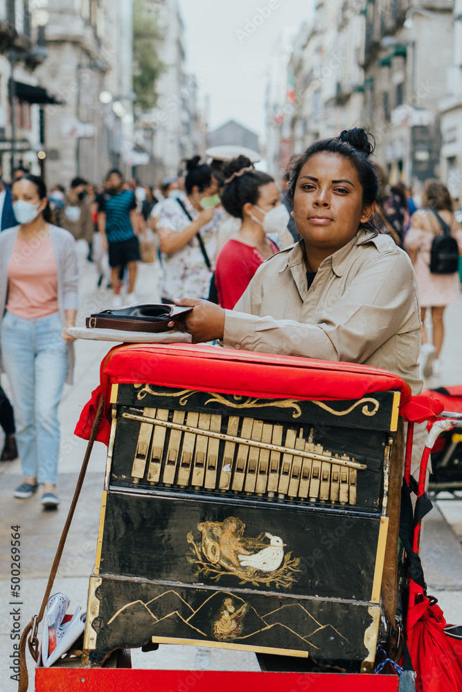Woman organ grinder on a Mexico City street in a crowd. Stock Photo ...