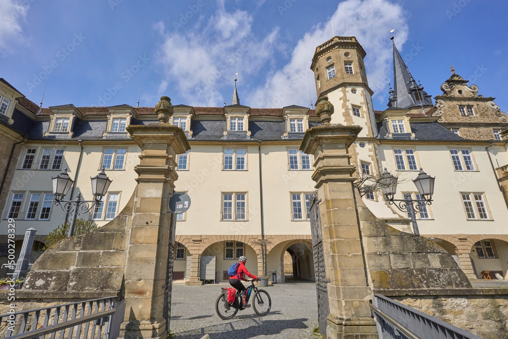 Öhringen. Baden-Wuerttemberg, Germany, 03-14-2022, woman on bicycle ...