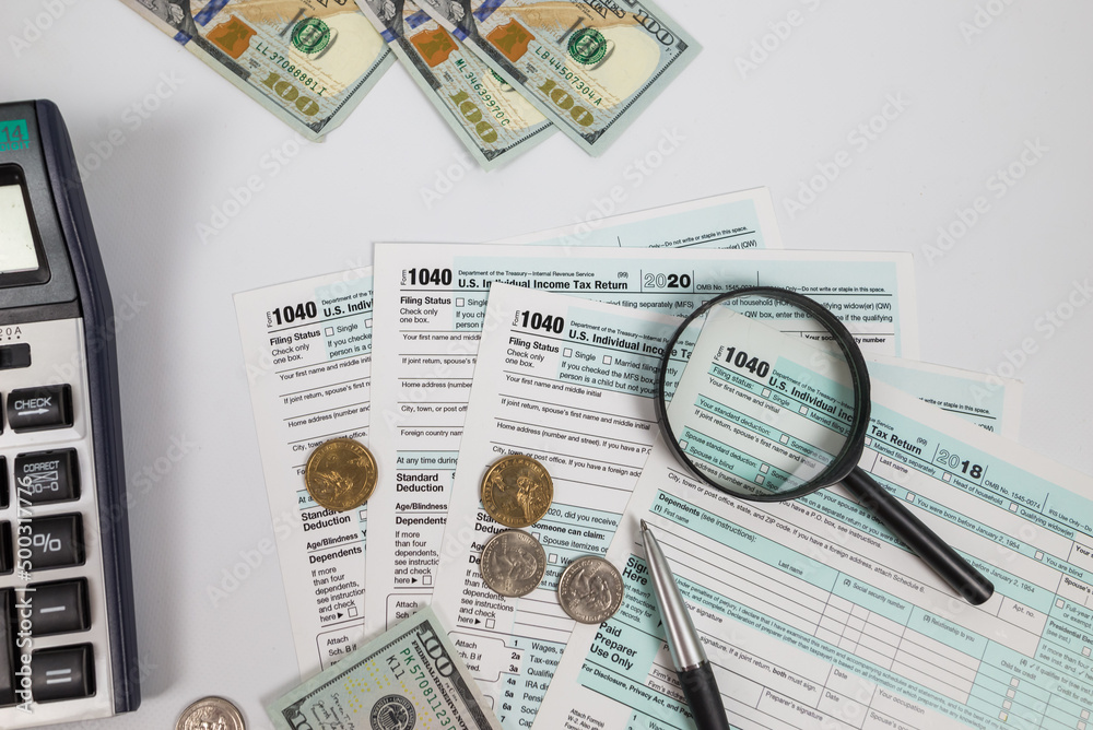 Blank forms 1040. US personal income tax return with accessories. Tax ...