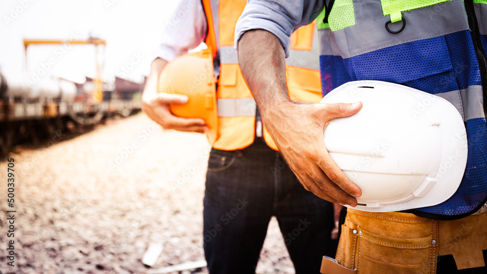 Engineer team holding hardhat Logistic expert by railway.Worker ...