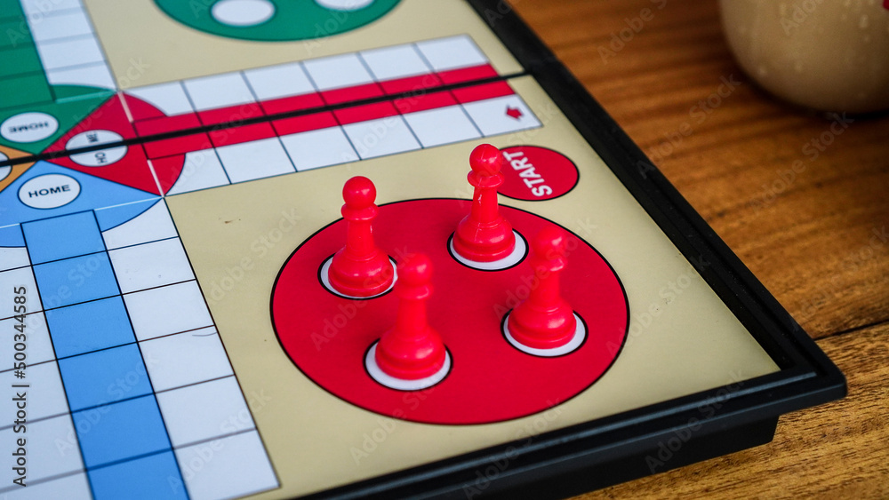Red player pawn for ludo game with four pawns Stock Photo | Adobe Stock