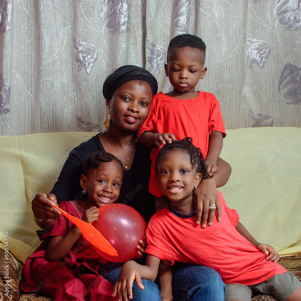 Lovely african Nigerian family consisting of a mother or guardian and ...