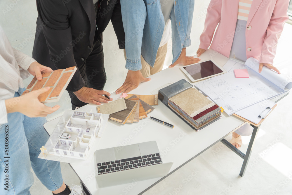 A group of multi ethnic business designer team talk, communicate ...