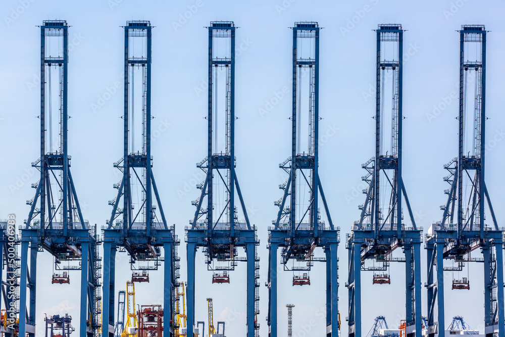 Photo Industrial port crane lift up loading import export containers ...