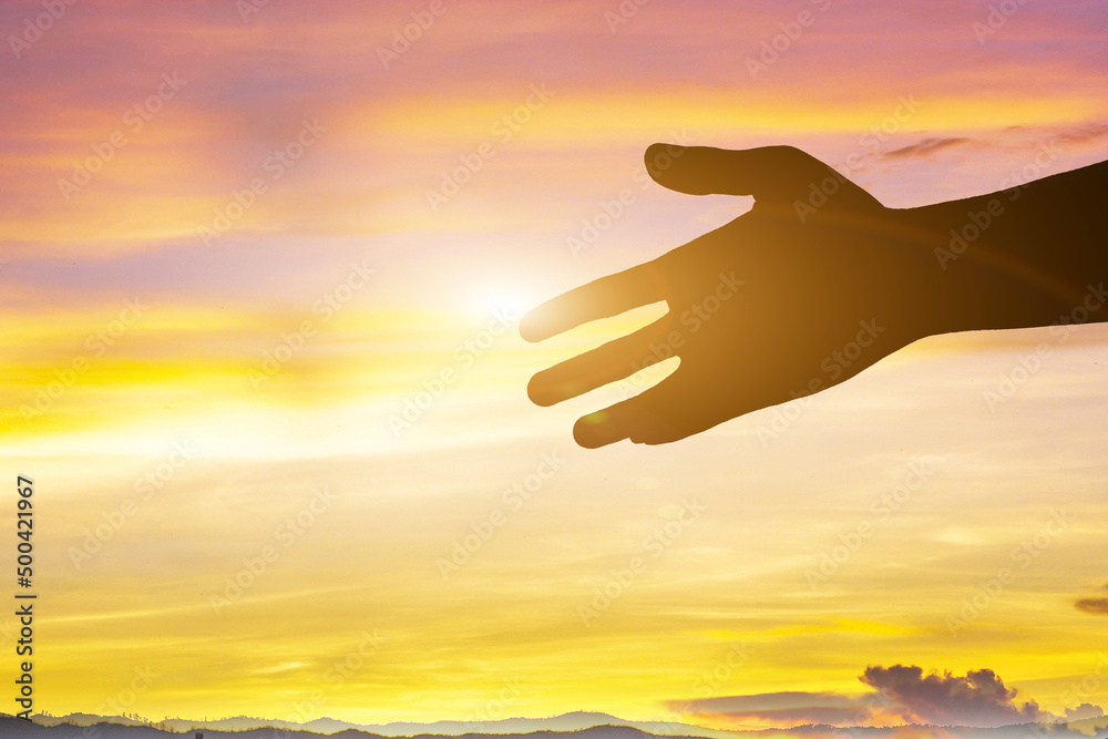 help with sunset background. silhouette of helping hands concept and ...