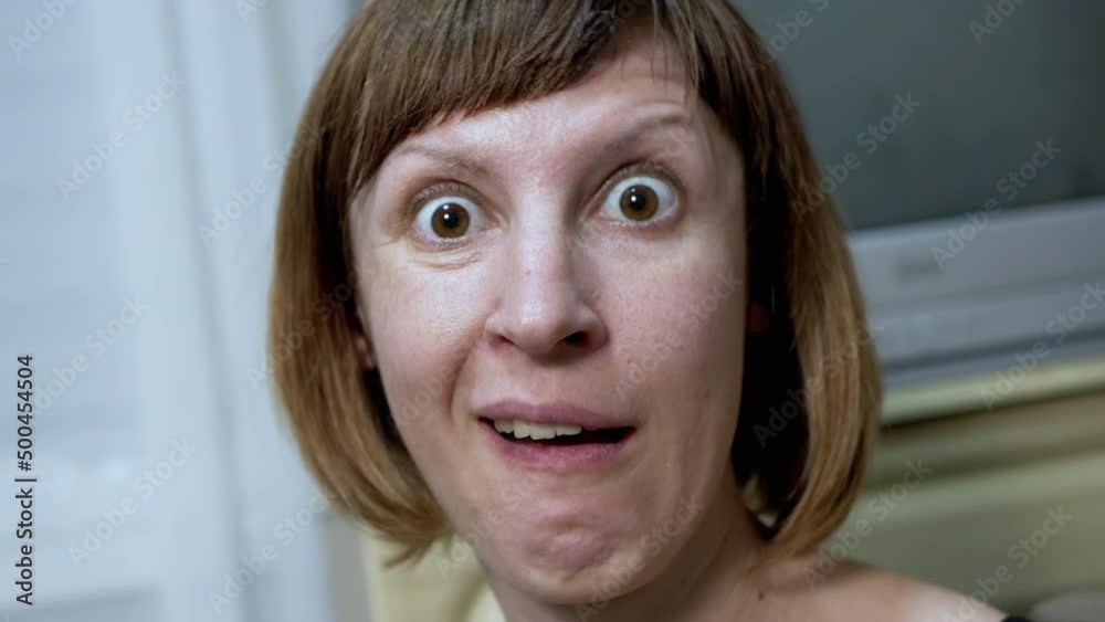 Close-up Facial Expressions of a Crazy Woman with Bulging Eyes, Crooked ...