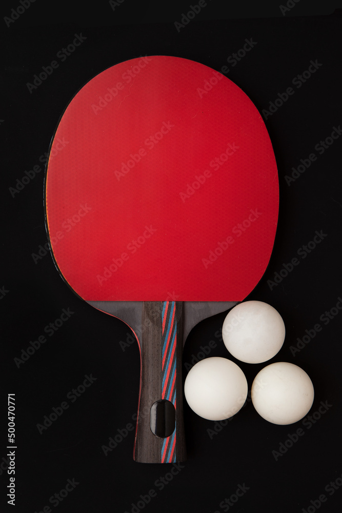 A ping pong racket on a uniform background with a table tennis ball ...