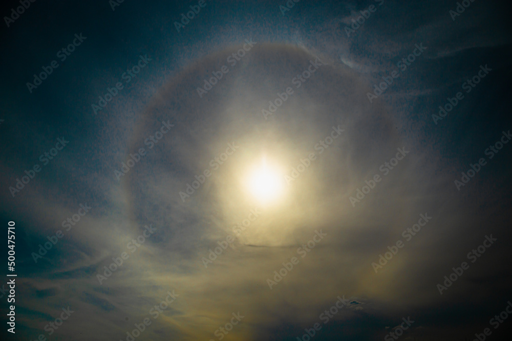 rainbow ring around sun in cloudy day.Fantastic Natural solar effect ...