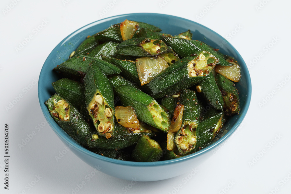Bhindi masala or ladies finger fry served with indian roti chapati or ...
