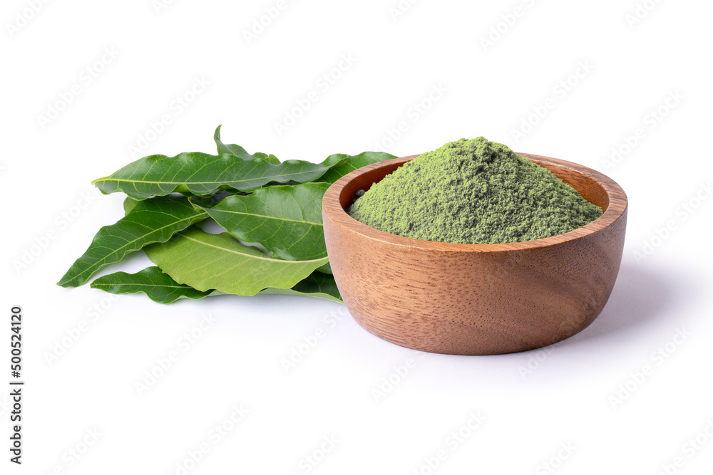 Dried neem leaf powder in wooden bowl and fresh neem leaves isolated on ...