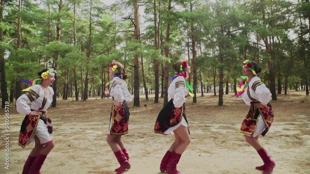 Group of young women in traditional costumes are dancing Ukrainian ...