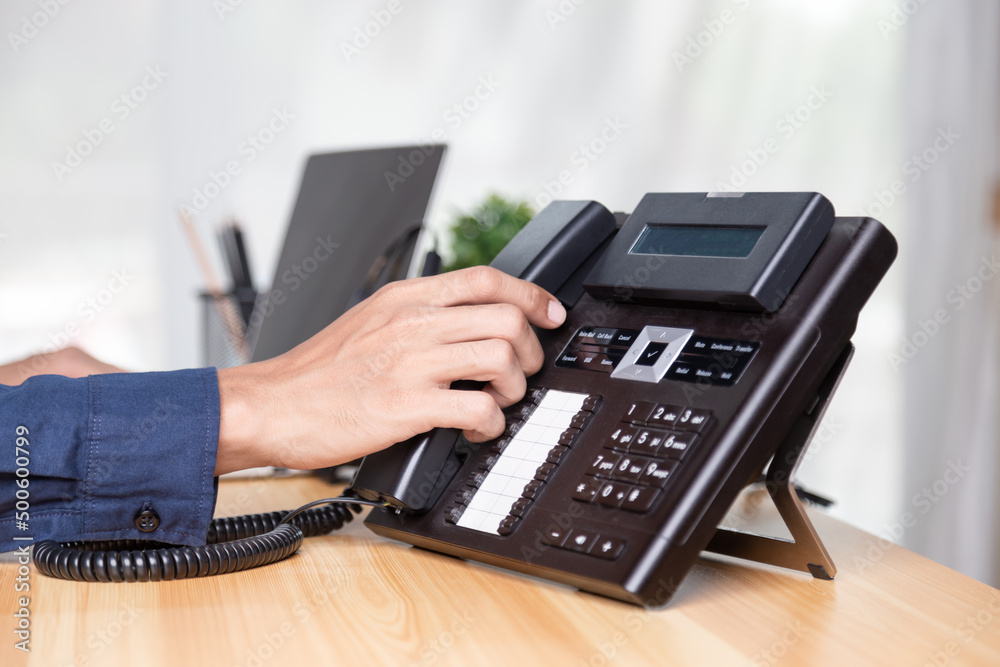 Call center staff man hand point to press the button number on the ...