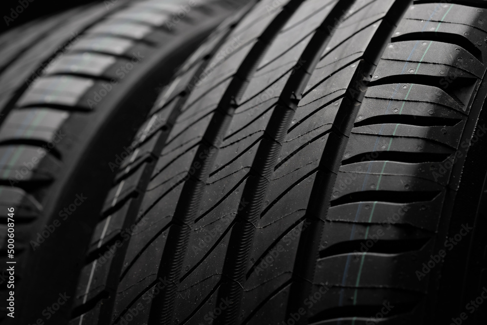 New car tires. Group of road wheels on dark background. Summer Tires ...