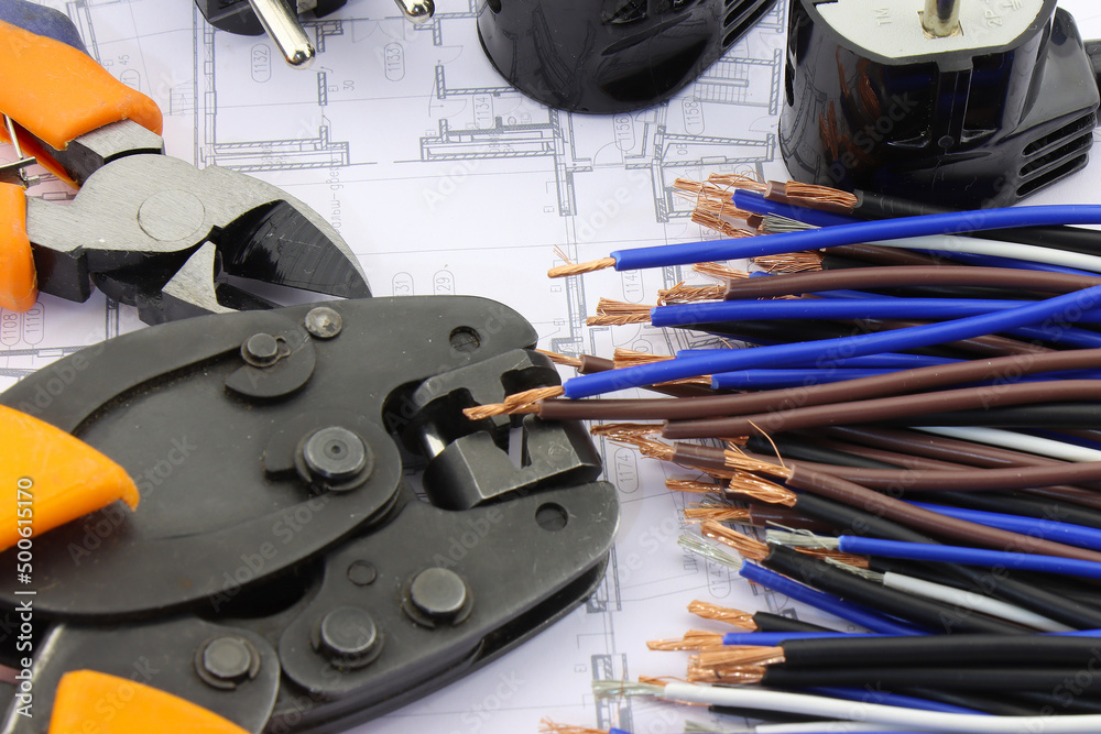 Tools for electrical installation on a close-up schematic diagram ...