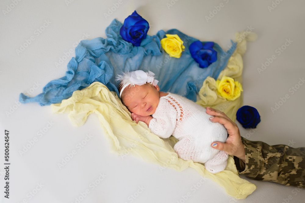 Ukrainian newborn in the studio patriotic blue yellow colors during the ...