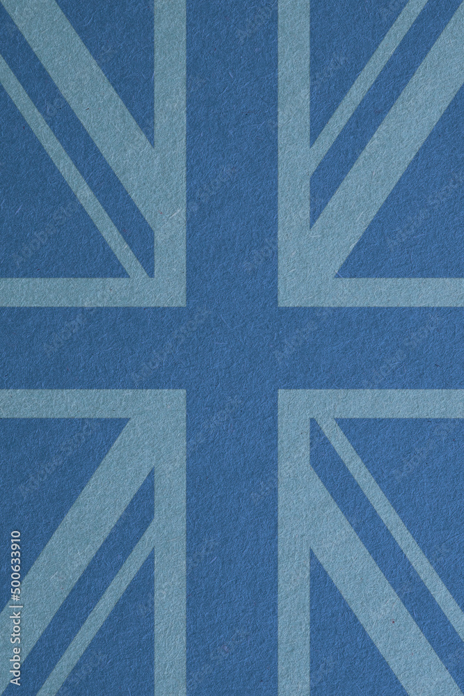 British flag outline on blue cardboard surface. Paper texture with ...