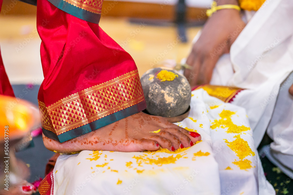 Tamil Hindu wedding ceremony rituals, bride's feet and rings close up ...