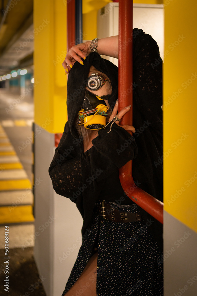 Sexy cyborg witch in cyberpunk goggles and a custom respirator, hooded ...