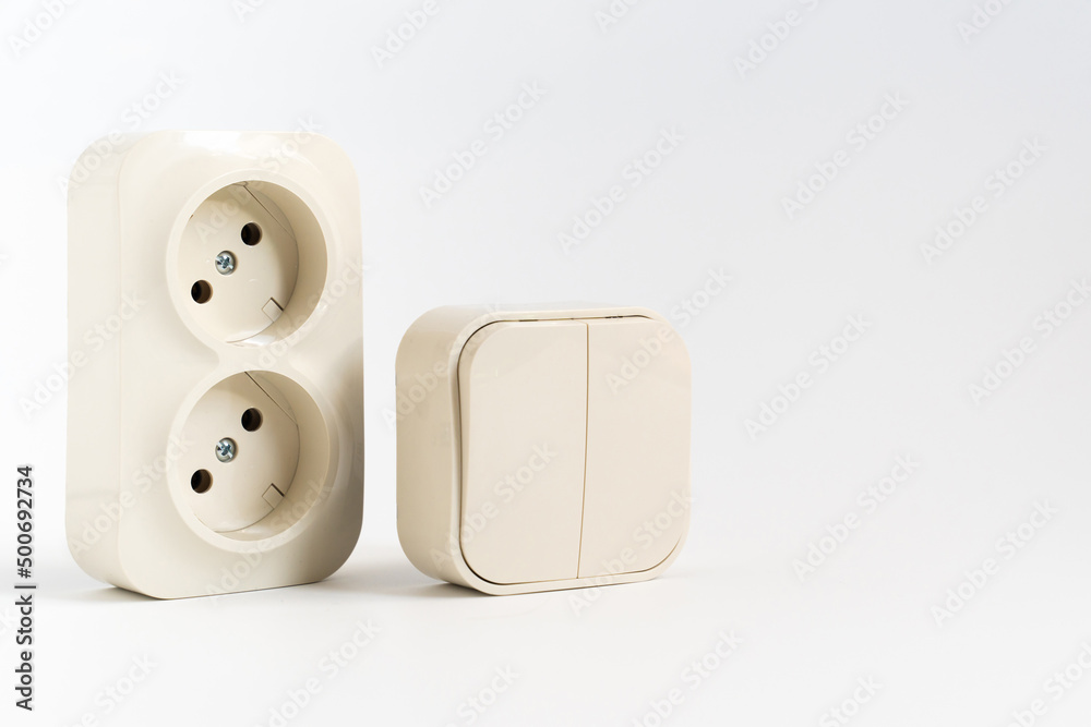 double socket and two-key light switch on white background. mechanical ...