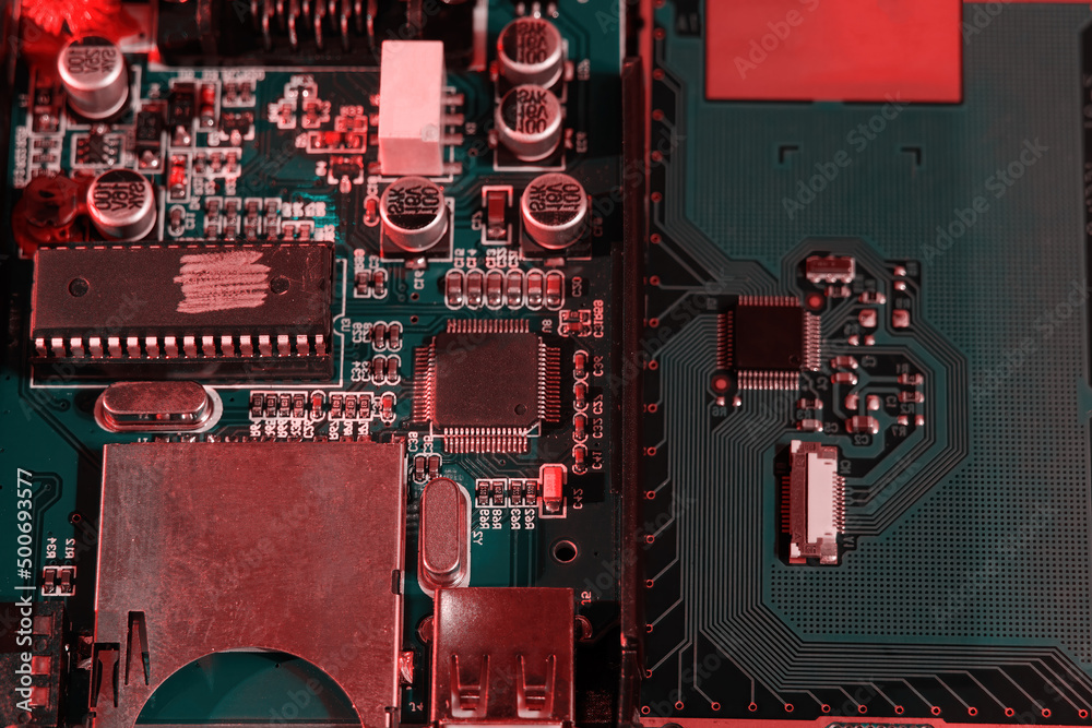 top view of matte PCB with chip, ports, capacitors and connections. IT ...