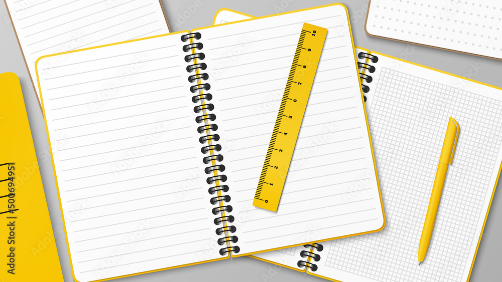 Composition with a bunch of notebooks and a stack notepad on the table ...