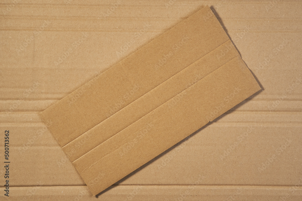 Recycled wrapping kraft paper with blank address card. Empty brown ...