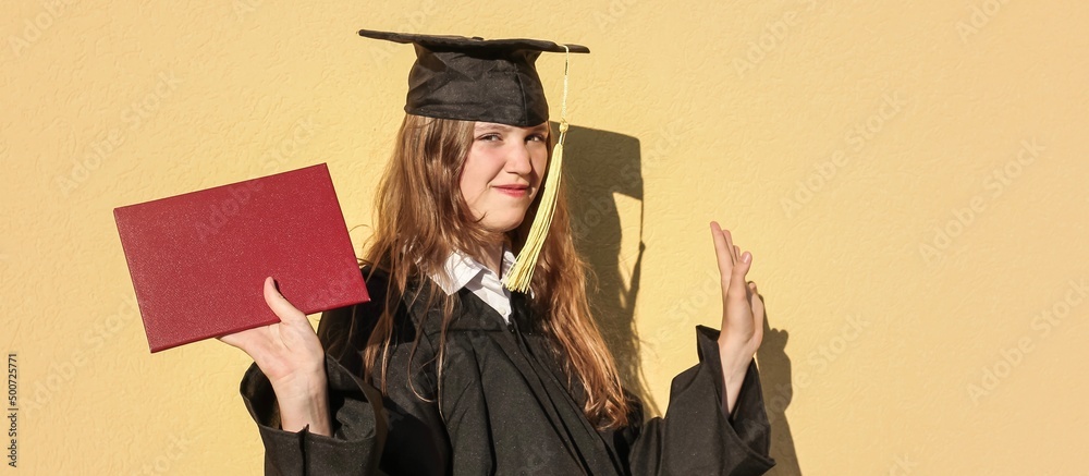 Cute teenage graduate girl laughing and having fun. No school, back to ...