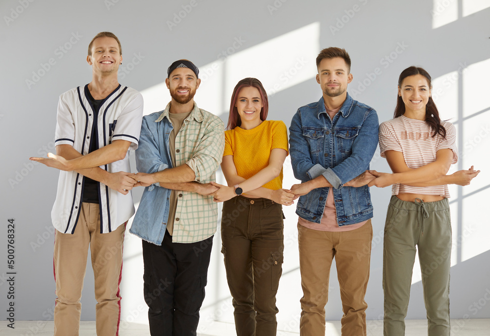 Foto de Together we stand strong. Team of happy, cheerful young people ...