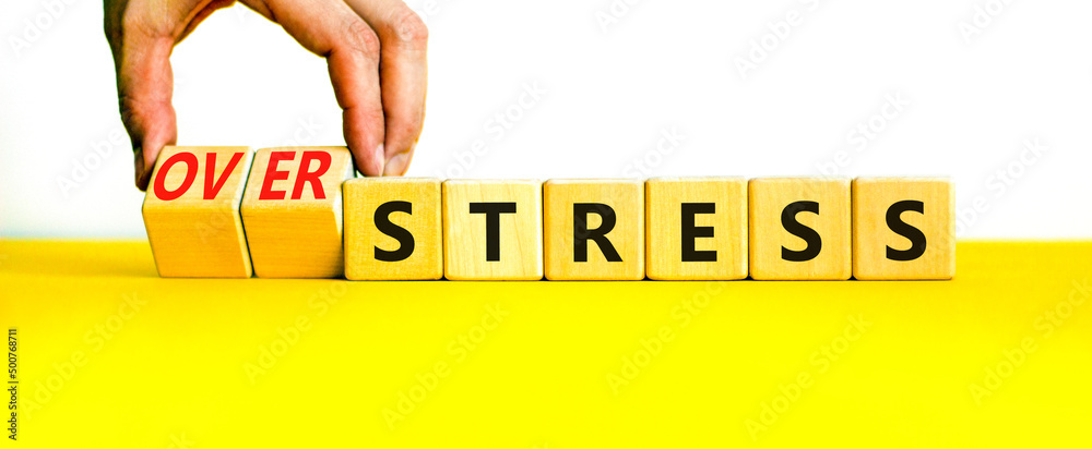 Over stress symbol. Psychologist turns wooden cubes and changes the ...