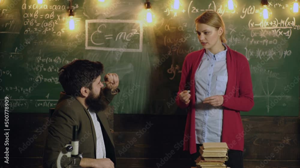 Teacher in math school explanation math lesson. Man and woman in ...