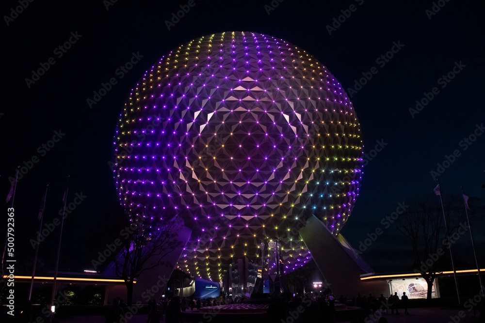 Nighttime view of the geodesic sphere at the entrance of Walt Disney ...
