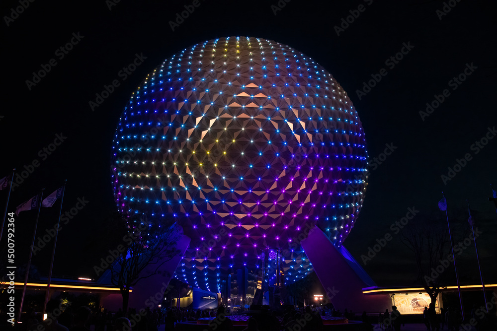 Nighttime view of the geodesic sphere at the entrance of Walt Disney ...