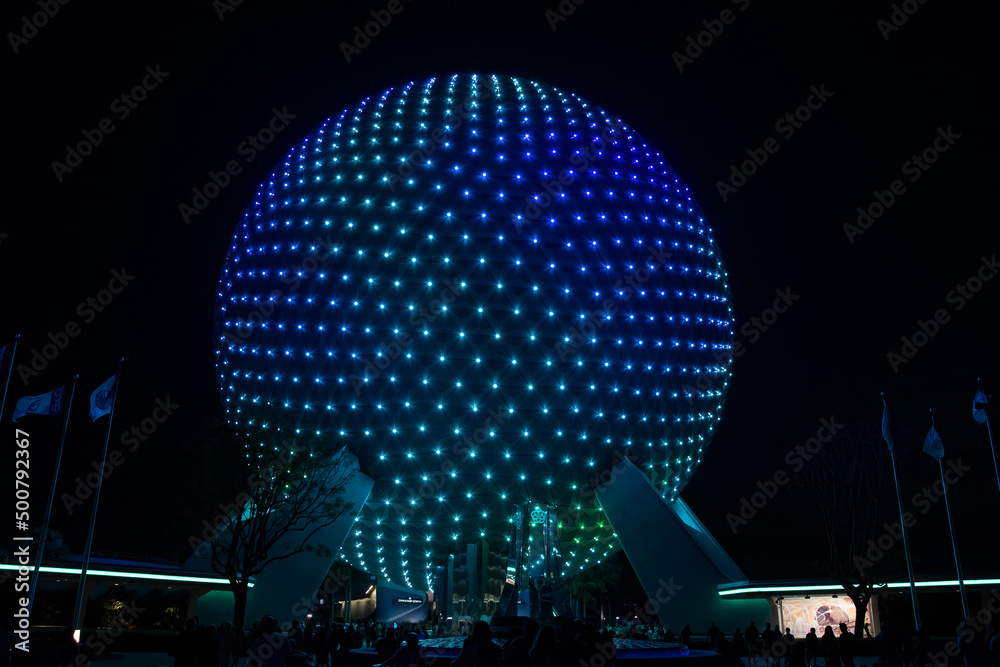Nighttime view of the geodesic sphere at the entrance of Walt Disney ...