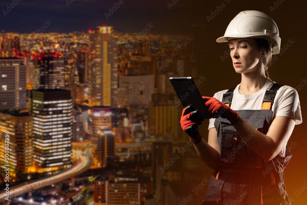 Female civil engineer with electronic tablet. Woman in hard hat on the ...