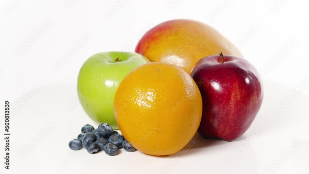 Mix of fresh and nutritious fruits: apples, mango, orange and ...