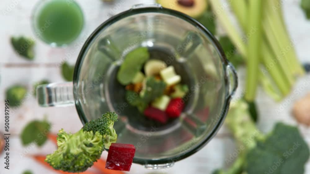 Fresh fruit and vegetables smoothie blended in blender, top view ...