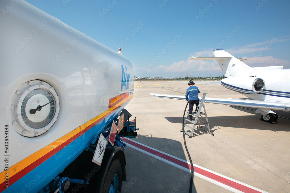 Refueling the jet plane at the airport Stock Photo | Adobe Stock