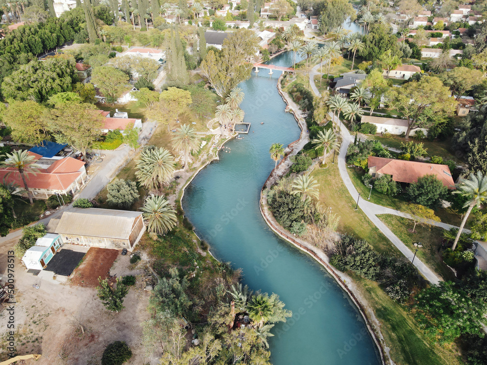 Aerial panorama view of Kibbutz Nir David in Northern Israel with nahal ...