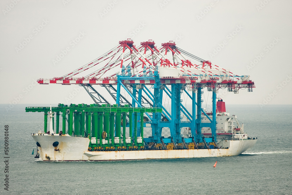Transportation by sea of berthing and rear container loaders STS and ...