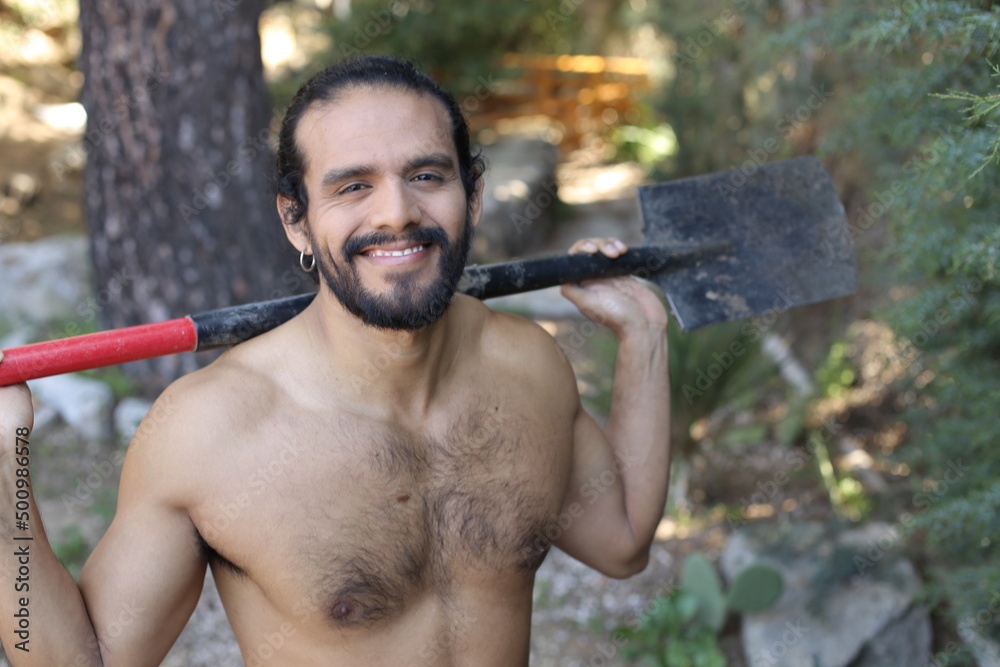 Sexy shirtless man using a shovel Stock Photo | Adobe Stock