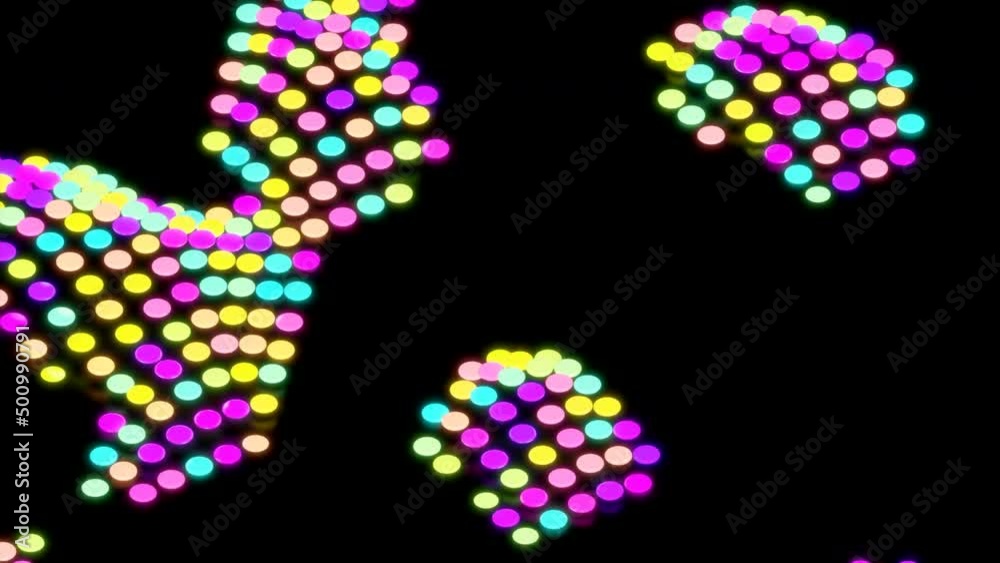 Vidéo Stock Colorful dots moving in spots on black background. Design ...