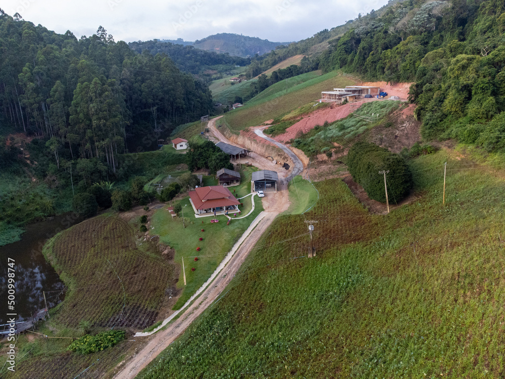 Small country town with food production on plantations, small houses ...