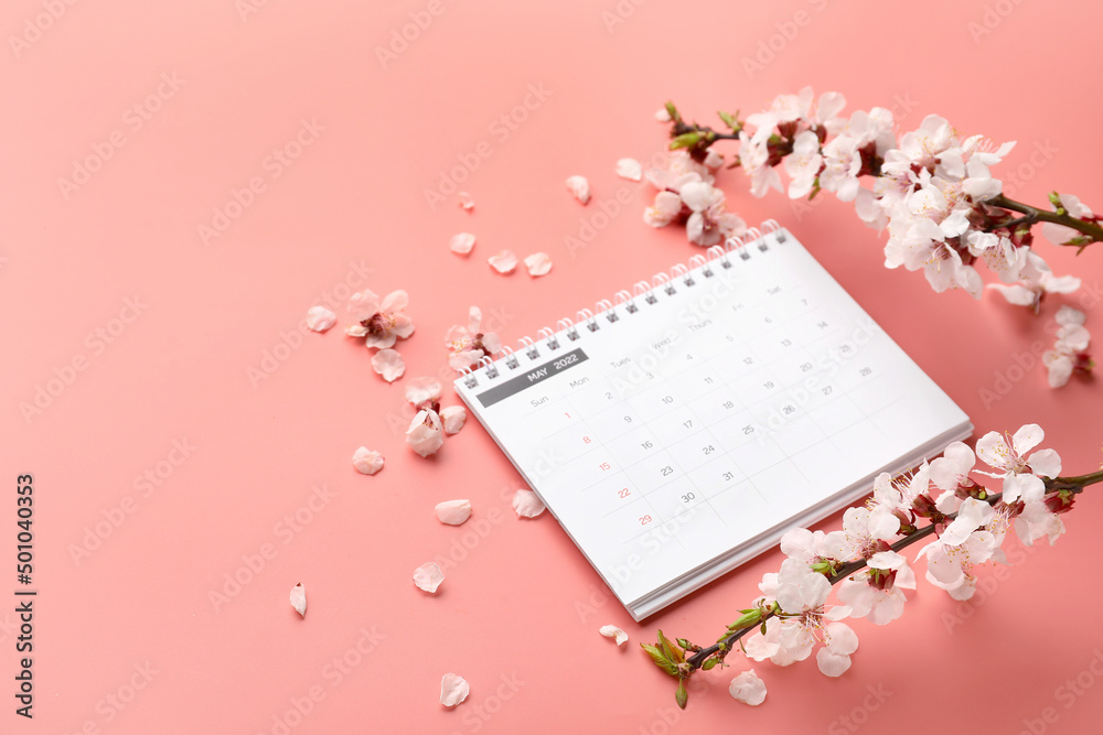 Beautiful blooming spring branches and calendar on pink background ...