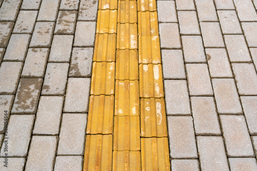 Tactile paving for blind handicap on tiles pathway ภาพถ่ายสต็อก | Adobe ...