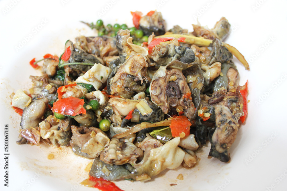 Fried Spicy Frog with herb and spices on plate - Stir fried frog and ...